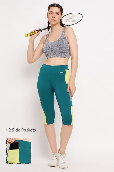Buy Snug Fit High-Rise Active Capri in Teal Blue with Coloured Panels & Side Pockets Online - Clovia